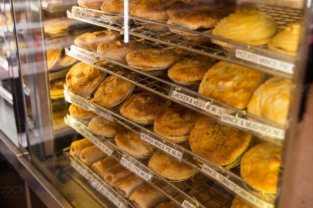 Image of full pie display cabinet at a local bakery - Austockphoto