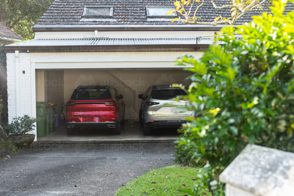 Image of garage with two cars - Austockphoto