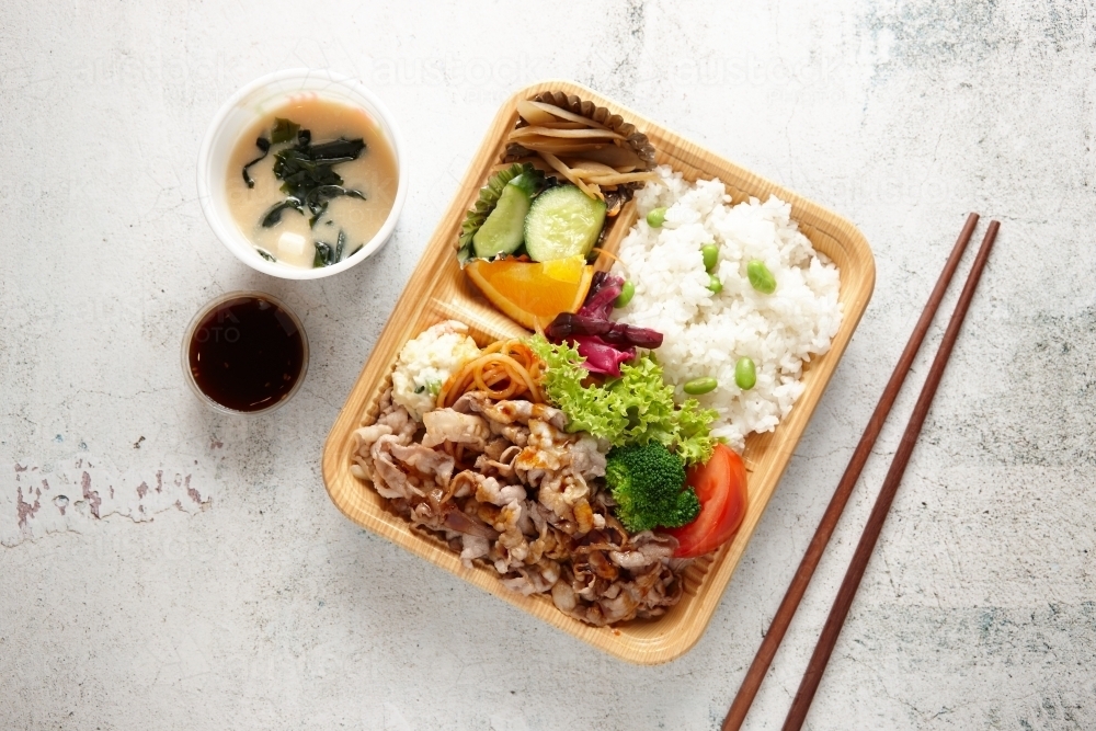 Image of Ginger pork bento dish with miso soup - Austockphoto