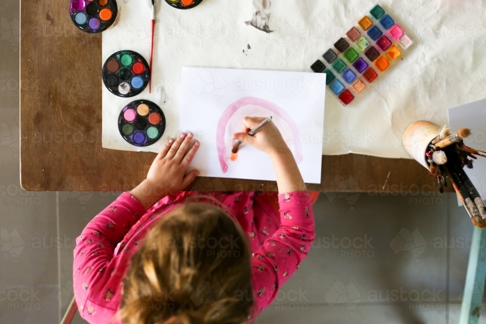Image of Girl doing painting - Austockphoto