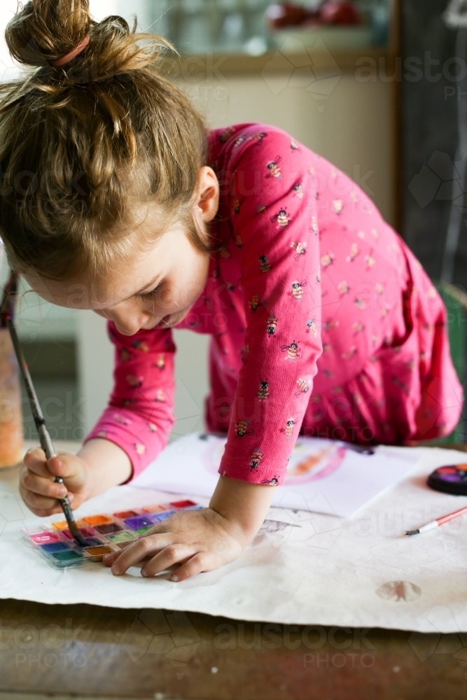 Image of Girl doing painting - Austockphoto