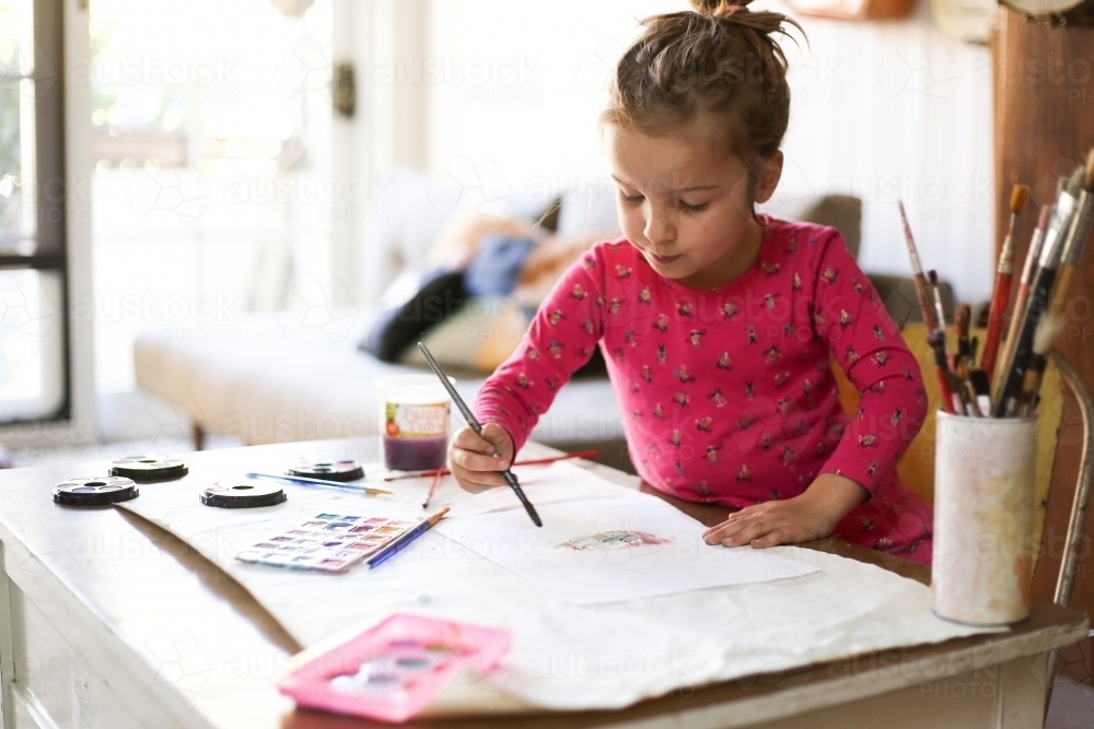 Image of Girl doing painting - Austockphoto