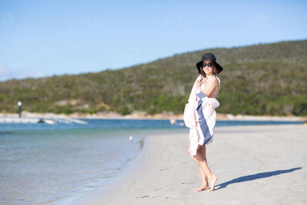 Image of Girl wearing hat on beach at Emu Point - Austockphoto
