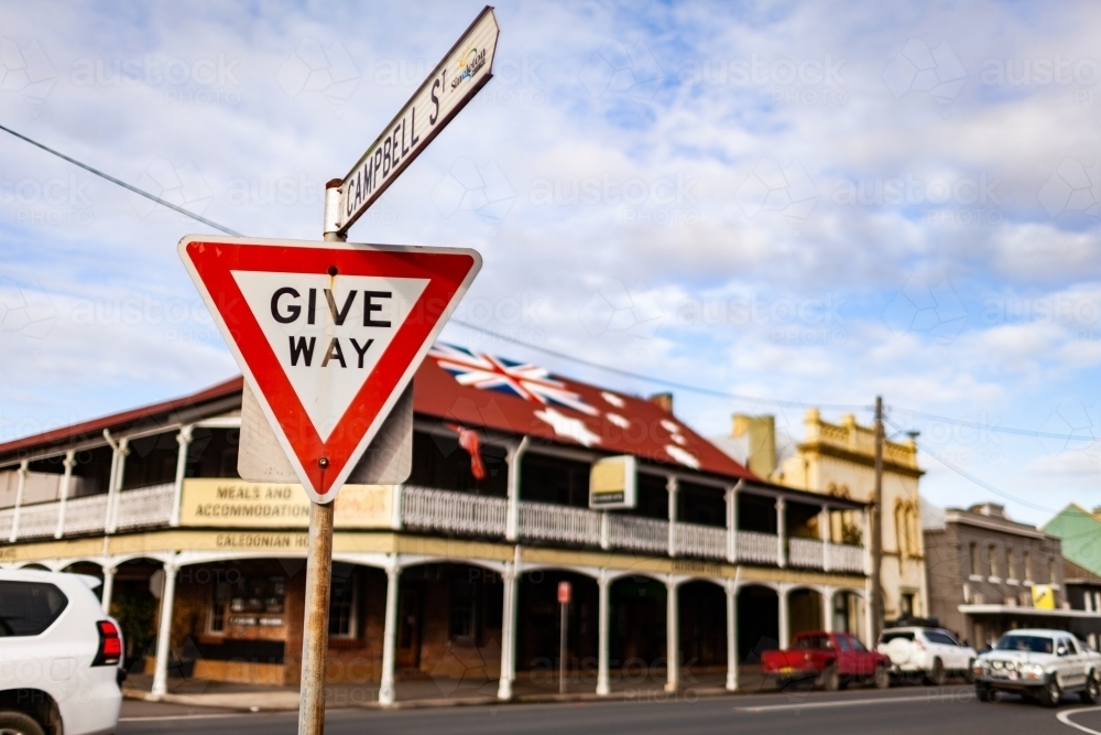 Image of Give way street sign at intersection of side road with main ...