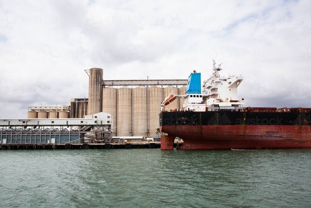 Image of Gladstone Harbour from the water with silos and ships ...