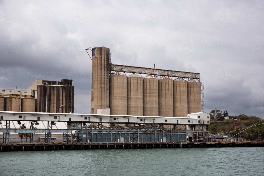 Image of Gladstone Harbour industrial mining industry silos - Austockphoto