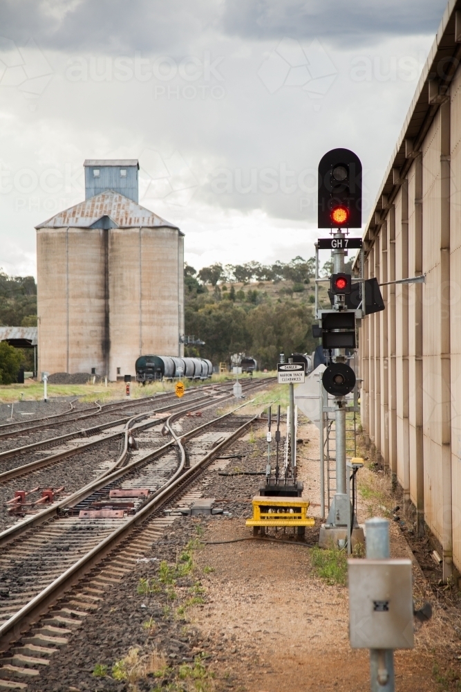 Image of Grain silos with train beside railway - Austockphoto
