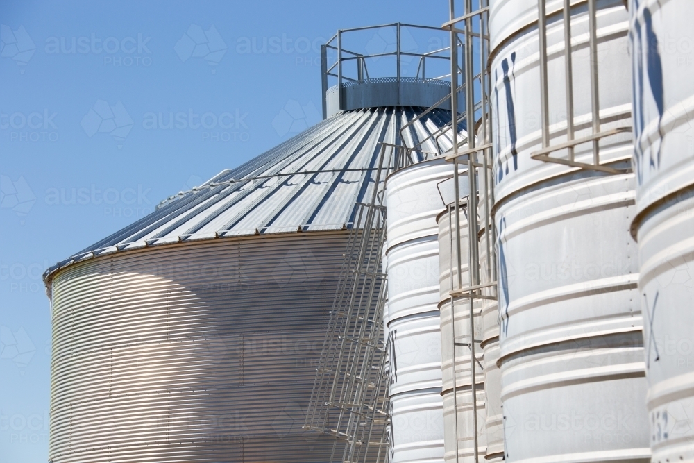 Image of Grain storage silos on a farm - Austockphoto