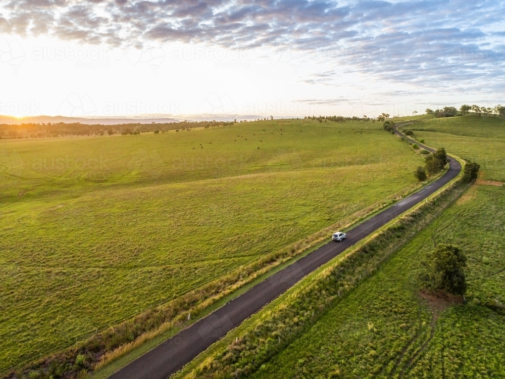 Image of Green hills and car on narrow country road in Australia ...