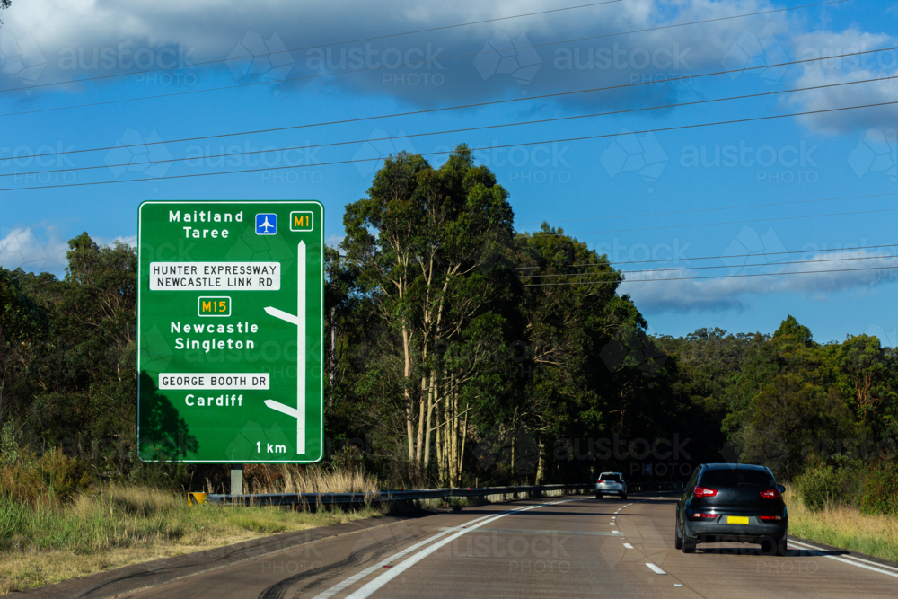 Image of Green roadside sign with directions to hunter expressway ...
