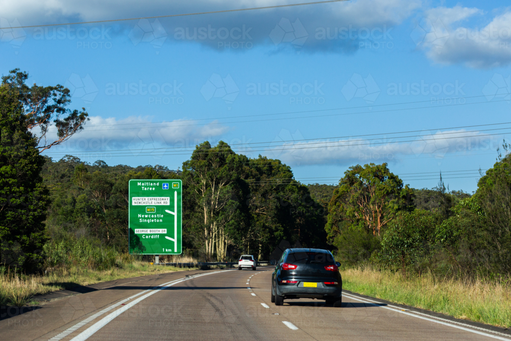 Image of Green roadside sign with directions to hunter expressway ...