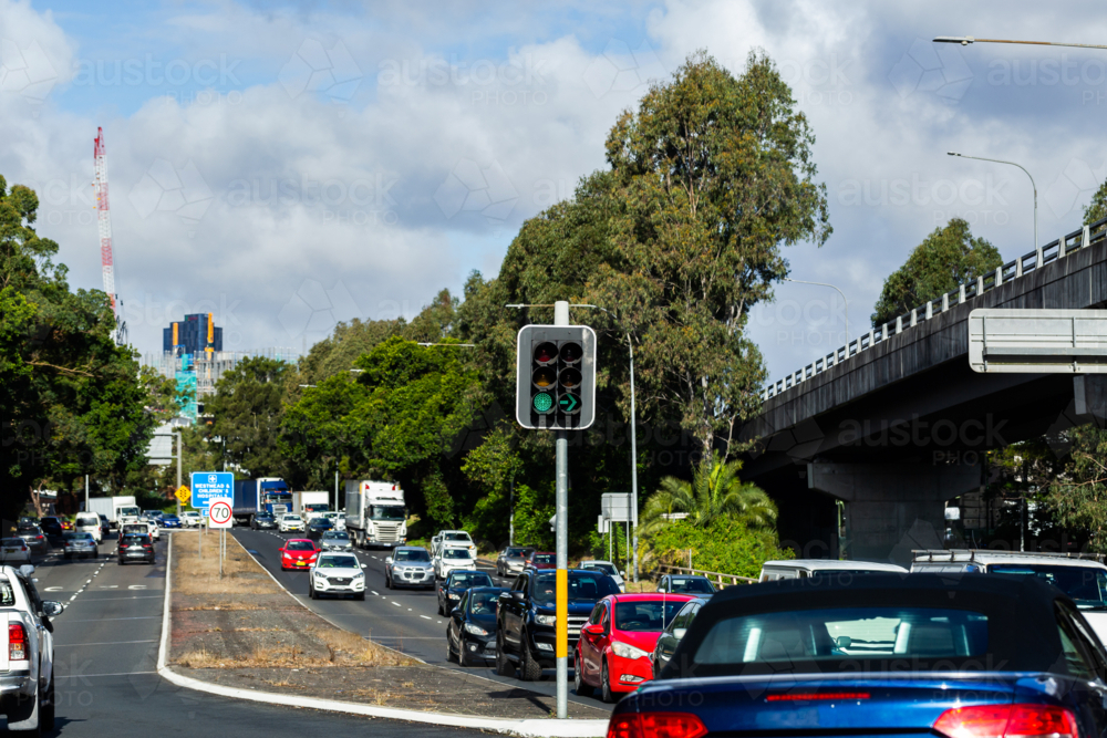 Image of Green traffic lights at city intersection with busy road full ...