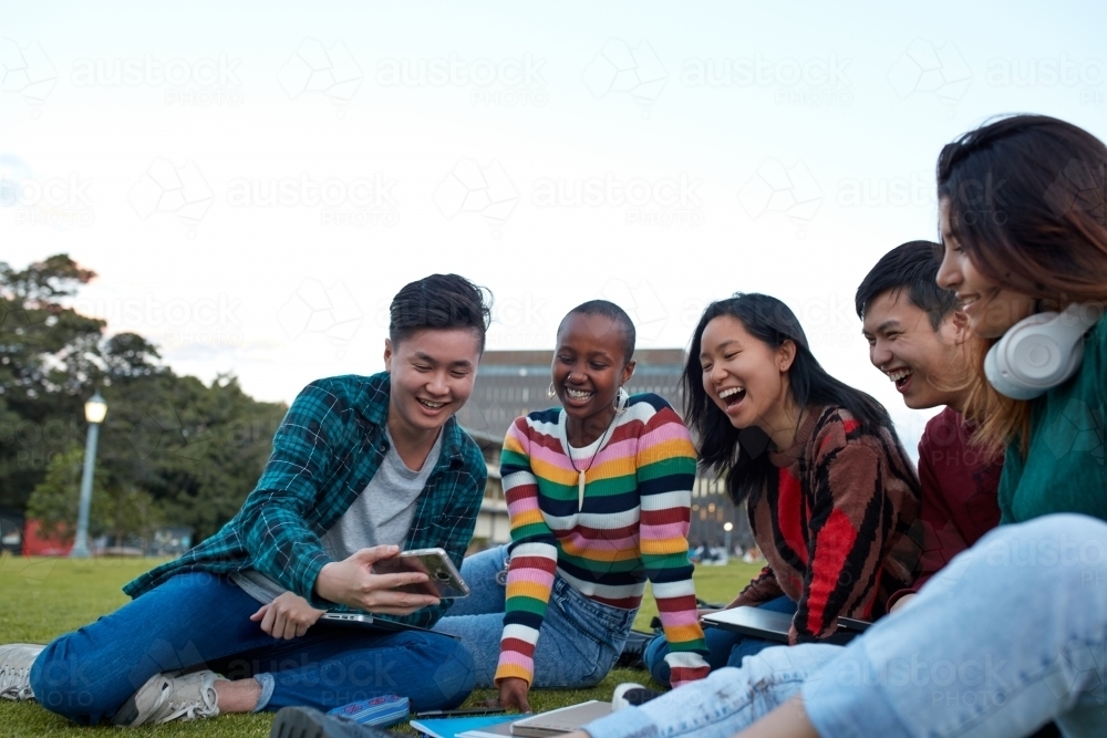 Image of Group of young university students hanging out sitting on ...