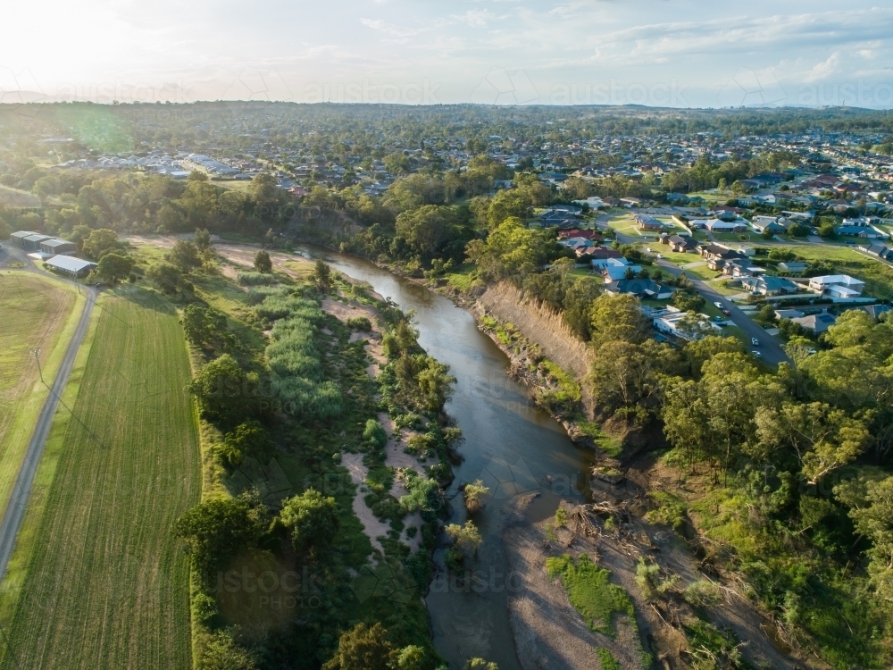Image of Gum trees beside Hunter River on sunlit summer day - Austockphoto