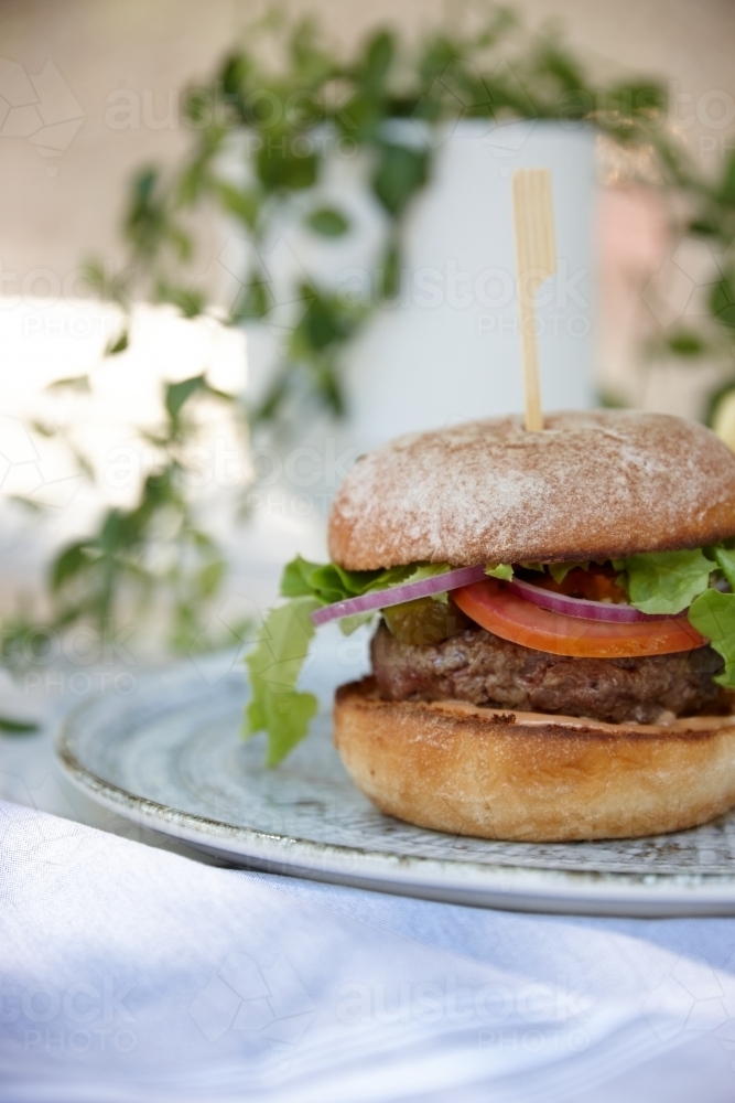 Image of Hamburger on plate - Austockphoto