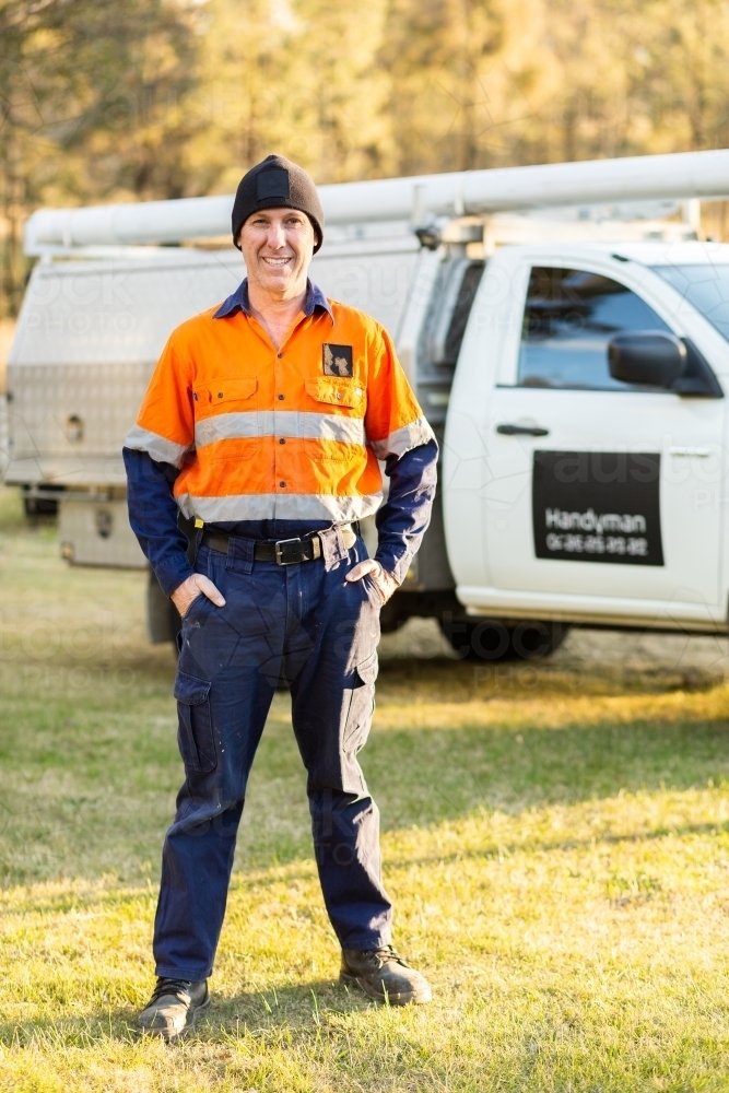 Image of Handyman portrait in winter with ute - Austockphoto