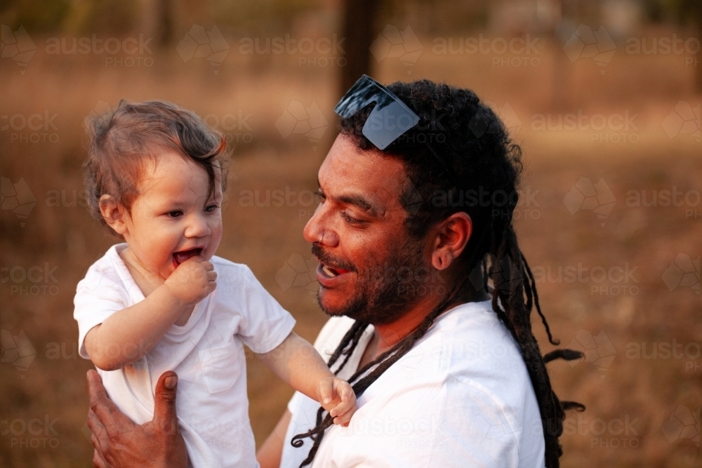 Image of Happy Aussie baby girl with aboriginal father smiling together ...