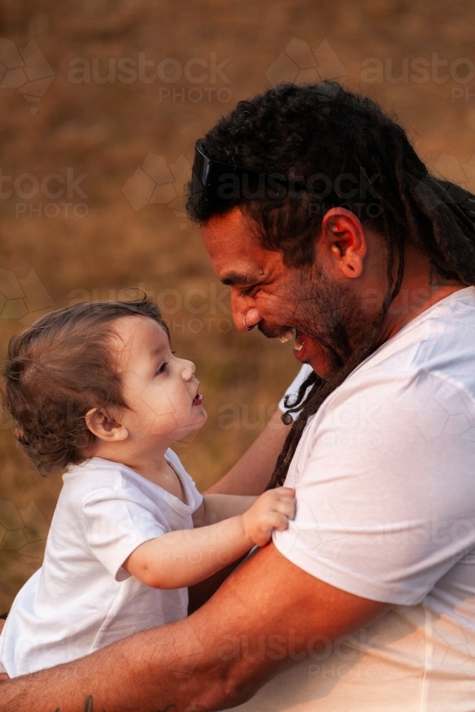 Image of Happy Aussie baby girl with aboriginal father smiling together ...