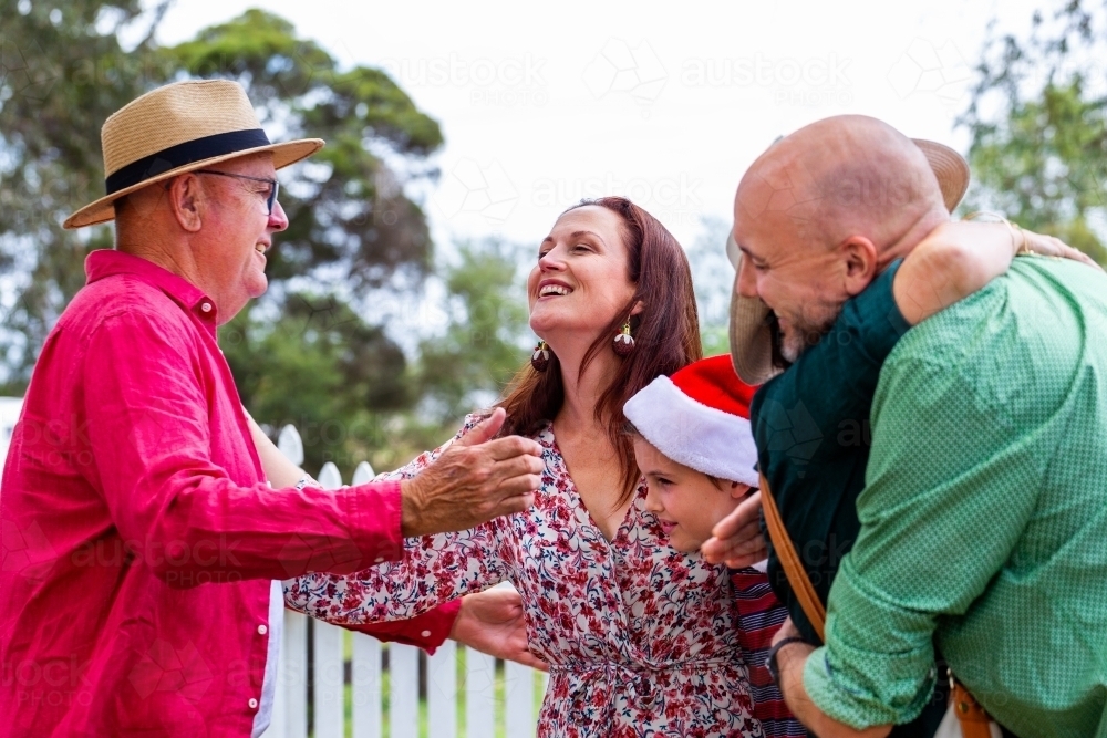 Image of Happy Aussie family of multiple generations greeting one ...
