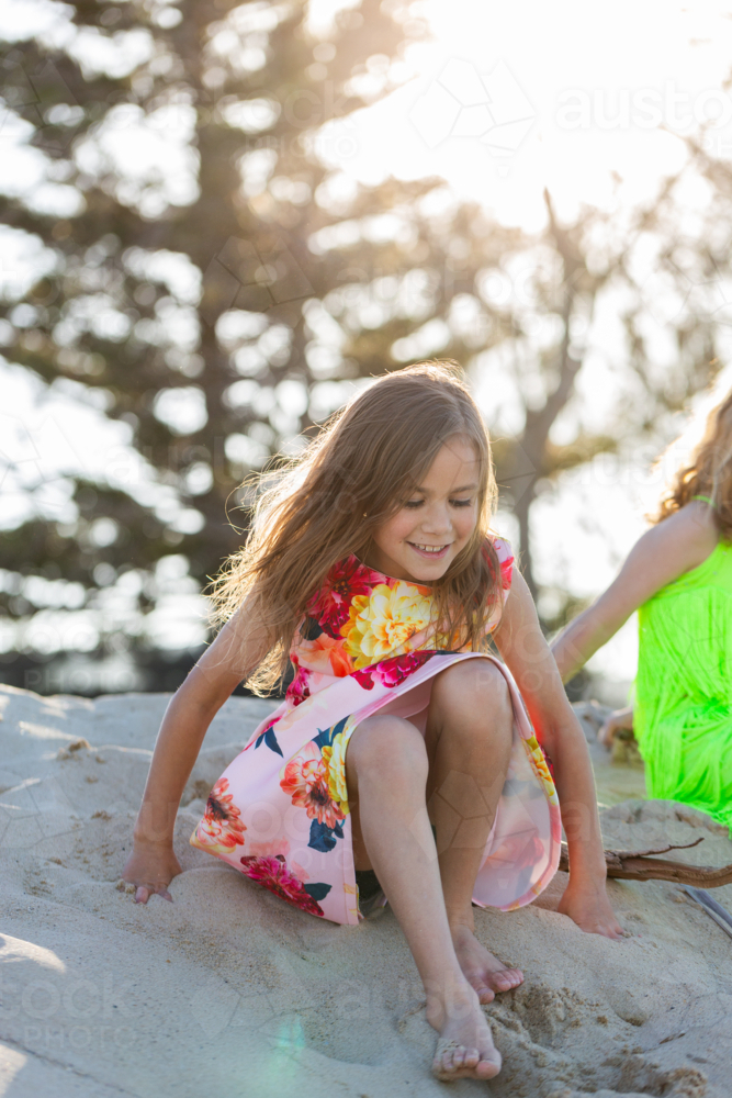 Image of Happy First Nations Australian child playing on sand dune at ...