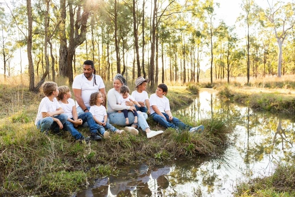 Image of Happy First nations Australian family sitting together by ...