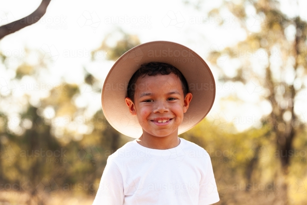 Image of Happy first nations australian kid in country setting wearing ...