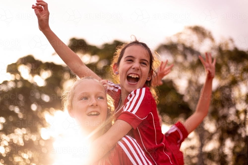 Image of Happy football team of tween girls celebrating together ...
