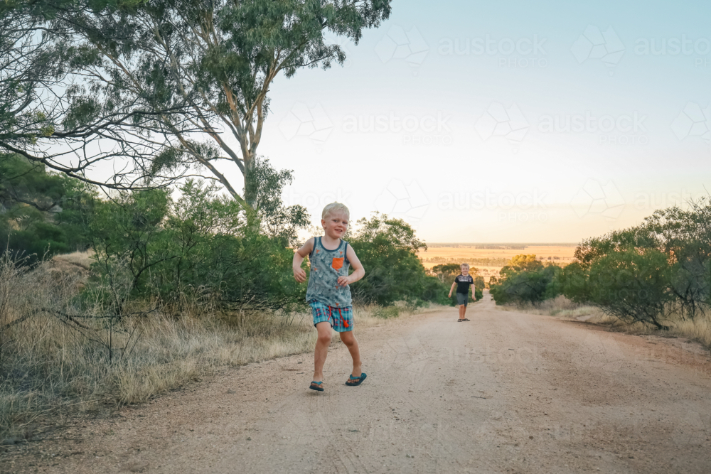 Image of Happy kids on bushwalk along rural Australian country road ...