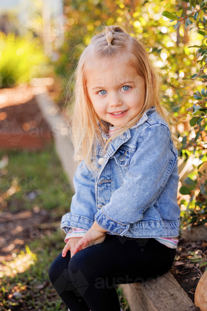 Image of Happy little preschool girl smiling at kindergarten - Austockphoto
