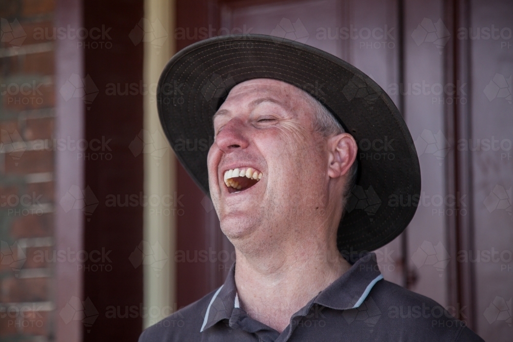 Image of Happy man laughing - Austockphoto