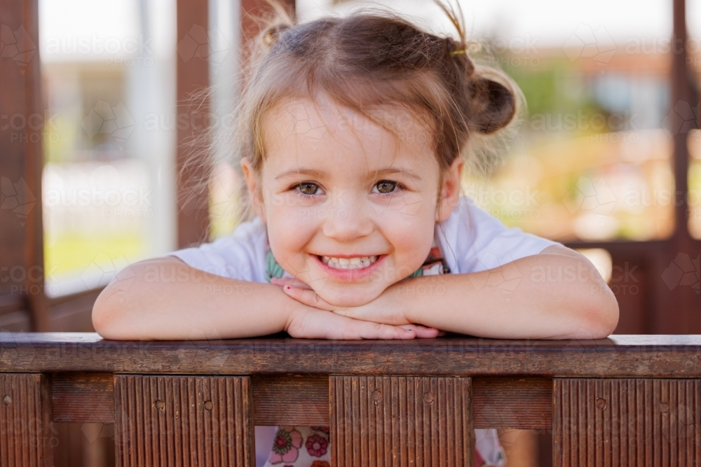 Image of Happy preschool girl smiling in cubby house at kindergarten ...