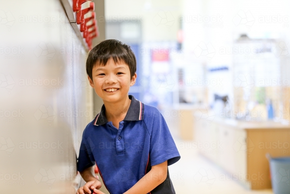Image of Happy primary school student - Austockphoto