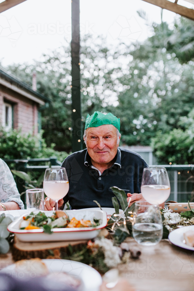 Image of Happy senior man seated at the dinner table - Austockphoto