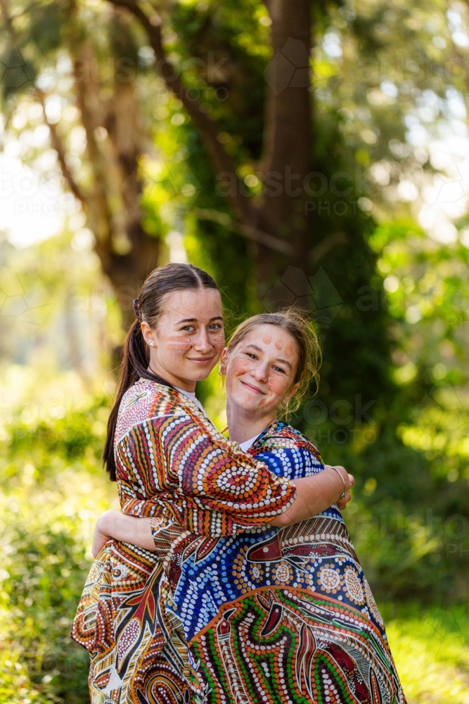 Image Of Happy Teen And Pre Teen Aboriginal Sisters Hugging Together