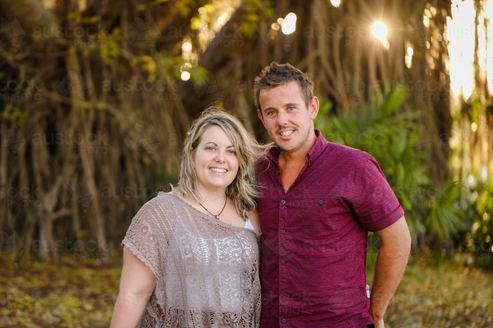 Image of Happy twenty-something couple in golden afternoon light at the ...