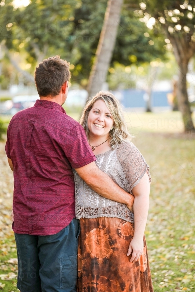Image of Happy twenty-something couple together in golden afternoon ...