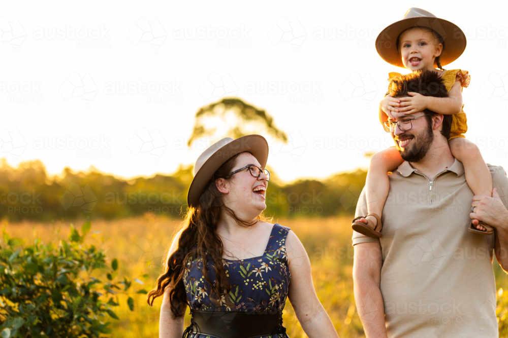 Image of Happy young Australian family of three smiling together in ...