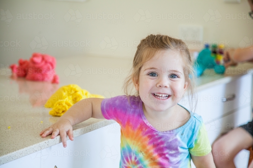 Image of Happy young child smiling at camera - Austockphoto