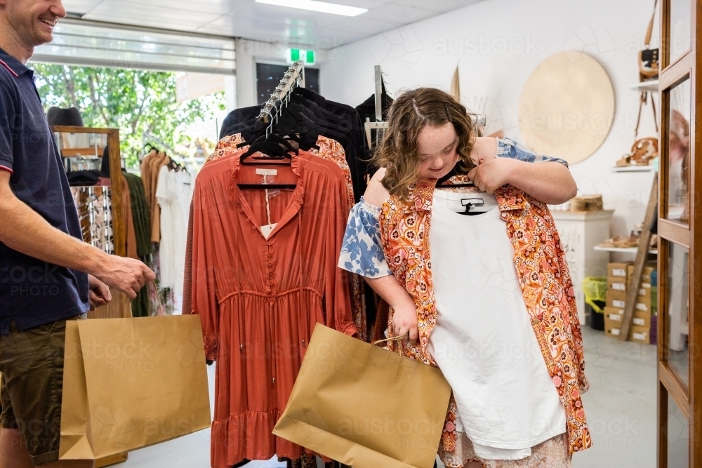 Image of Happy young lady with down syndrome shopping in dress and ...