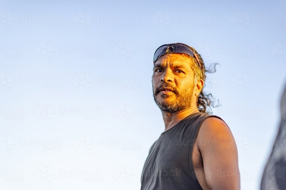 Image of head and shoulders of one aboriginal man standing proudly with ...