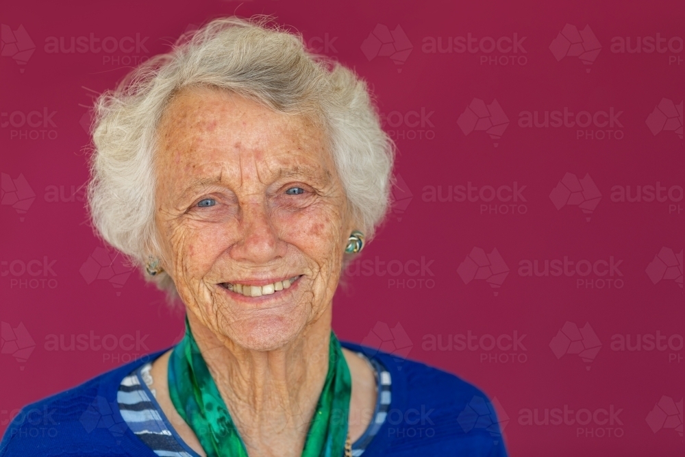 Image of head and shoulders of vivacious octogenarian smiling and ...