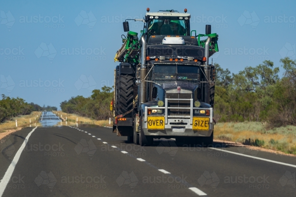 Image of Head on view of a semi trailer driving down the road carrying ...