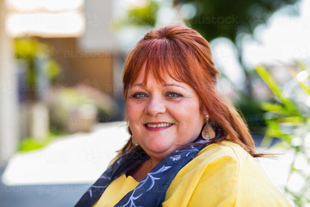 Image of Headshot of happy smiling middle age woman wearing yellow in ...
