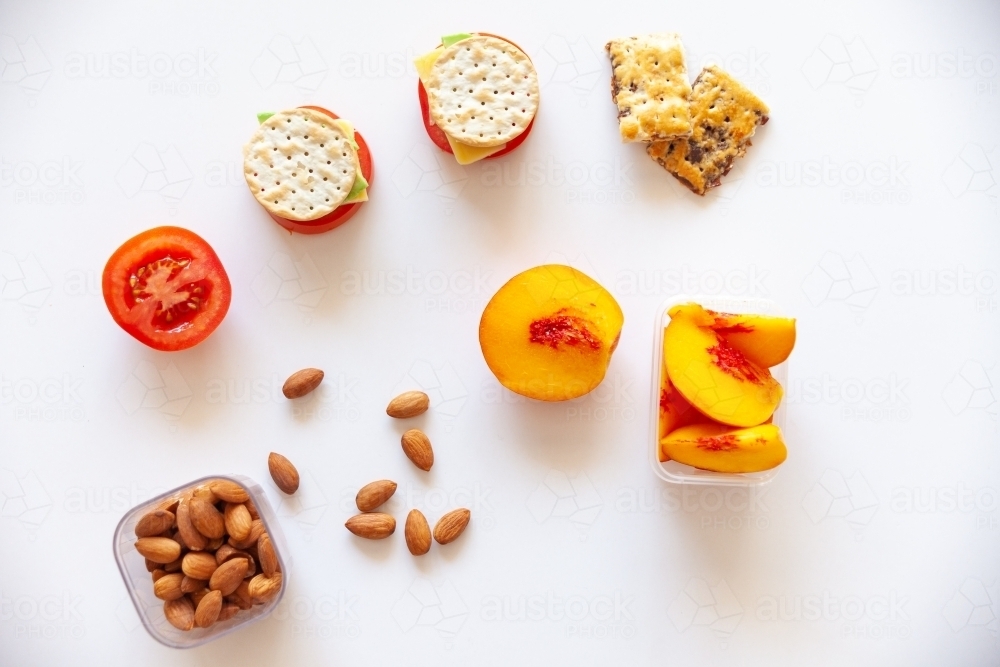 Image of healthy snack foods laid out on white bench - Austockphoto