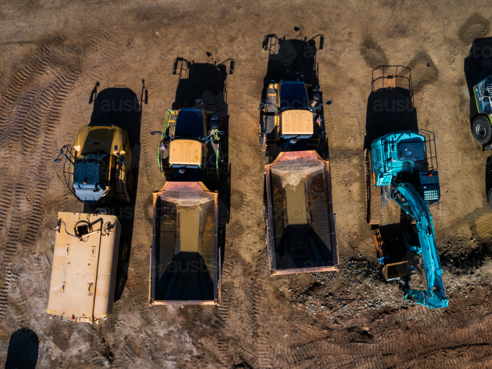 Image of Heavy earthmoving machinery parked on highway road ...