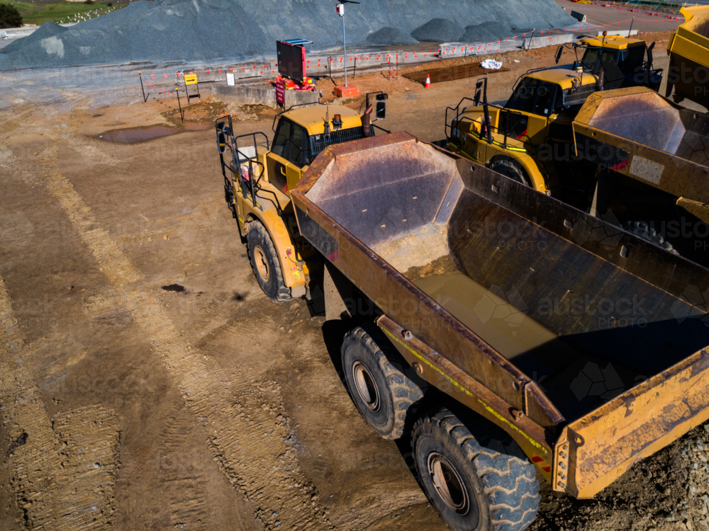 Image of Heavy earthmoving machinery parked on highway road ...