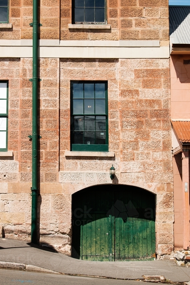 Image of hewn sandstone facade of historic building - Austockphoto