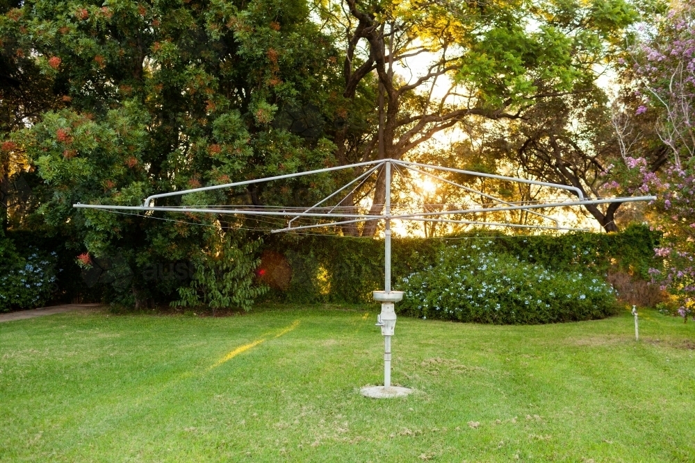 Image of Hills Hoist washing line on neat lawn grass on autumn ...