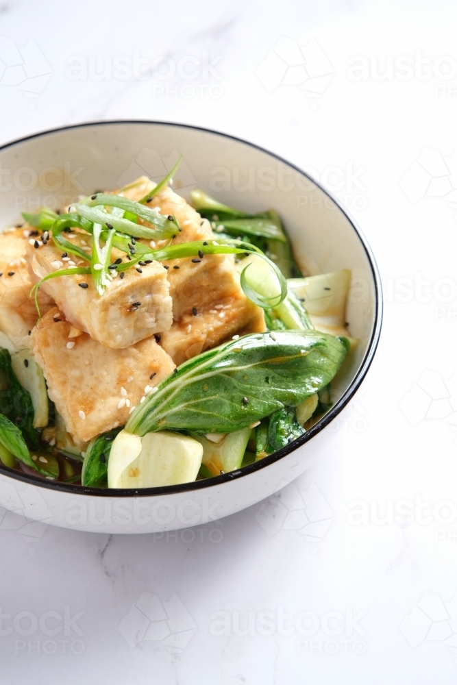 Image of Hoisin tofu pho garnished with black sesame seeds. - Austockphoto