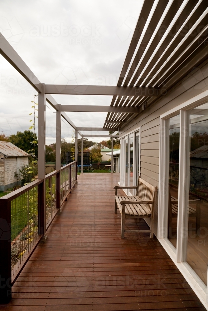 Image of Home extension of weatherboard, merbau decking and steel with ...
